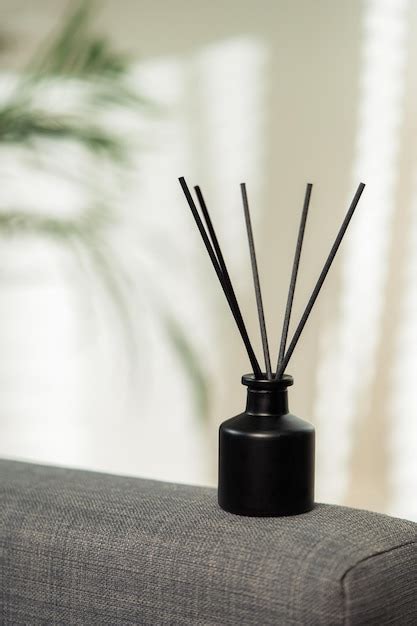 Premium Photo Aroma Diffuser Bottle With Sticks In Living Room