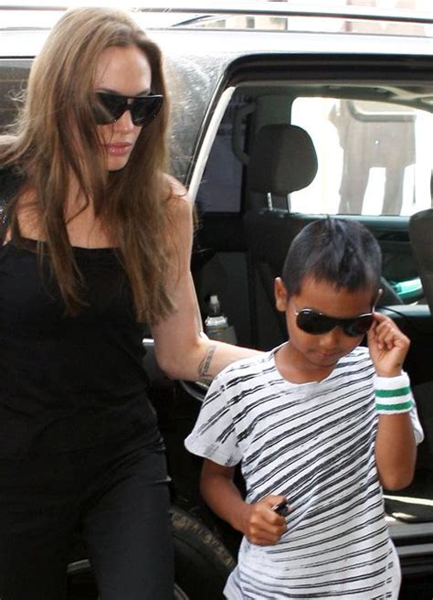 PHOTOS Angelina Jolie Takes Off With Maddox