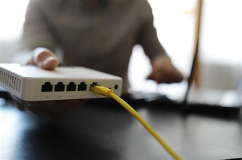 Premium Photo Modern Dual Band Wireless Router Man Working In The Background Fast And Wireless