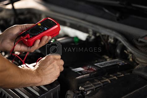 Check Battery Voltage With Electric Multimeter Man Using Multimeter To