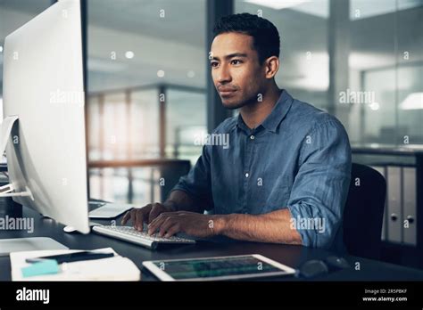 Typing Man And Programmer On Computer In Office At Night For Deadline
