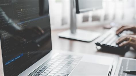 Premium Photo Programmer Working In A Software Development And Coding Technologies Website