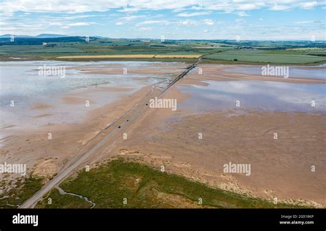 Aerial View Of The Lindisfarne Holy Island Causeway That Links It To
