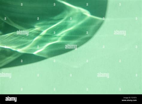 Trendy Mint Colored Abstract Background With Light And Shadows Caustic