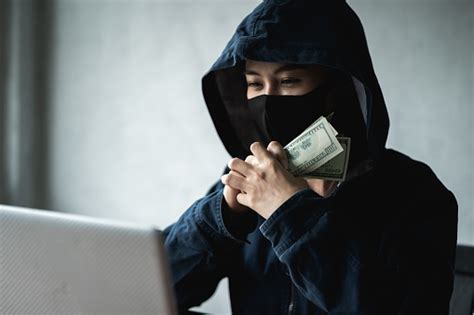 Woman Dangerous Hooded Hacker Held The Money After Successfully Hacking