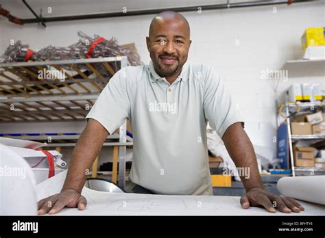 Workman Reading A Blueprint Stock Photo Alamy