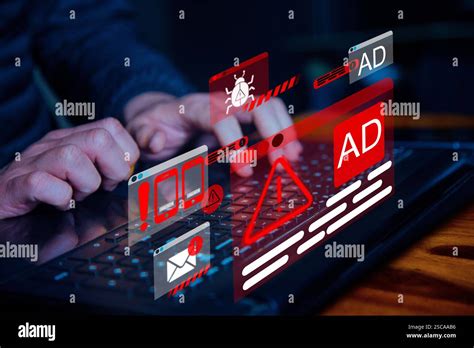 Businessman Hands Typing On Laptop With Triangular Malware Caution