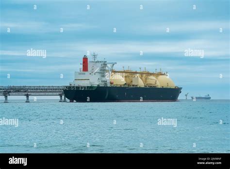 Lng Tanker During Loading At An Liquefied Natural Gas Offshore Terminal
