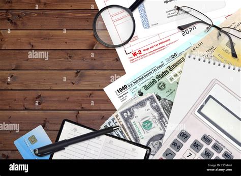 Irs Form 1040 Individual Income Tax Return And W 2 Wage And Tax Statement Lies On Office Table
