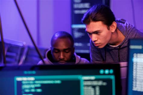 Premium Photo Hackers Analyzing And Discussing Malicious Code On Computer Screen Planning
