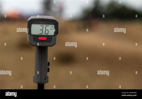 An Electronic Speed Gun With A Digital Display Measures A Vehicle Travelling At 36 Mph 58 Kph
