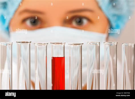 In A Chemical Laboratory A Woman Analyzes Test Tubes Medical Experiment Stock Photo Alamy