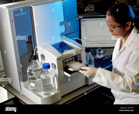 Biomolecule Interaction Analysis Technician Using A Surface Plasmon Resonance Spr Machine To