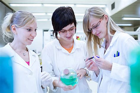 A Woman Scientist Conducting Experiments In A Chemical Laboratory Photo