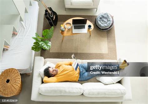 Male Laying Legs Crossed Photos And Premium High Res Pictures Getty