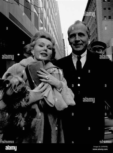 Zsa Zsa Gabor Holds Her Left Hand Up For All To See The Large Diamond