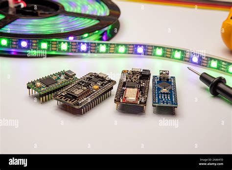 Selection Of Small Development Boards Displayed With Led Strip Meter