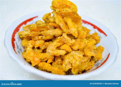 Savory And Delicious Bitter Melon Chips In A Bowl On A White Background