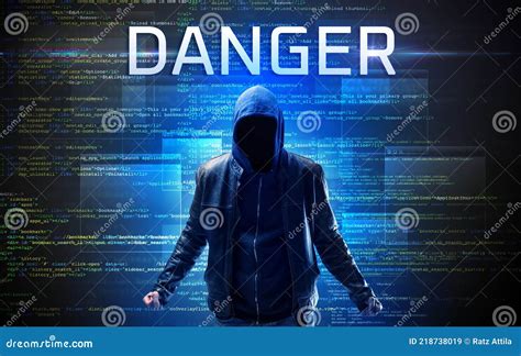 faceless hacker on code background stock image