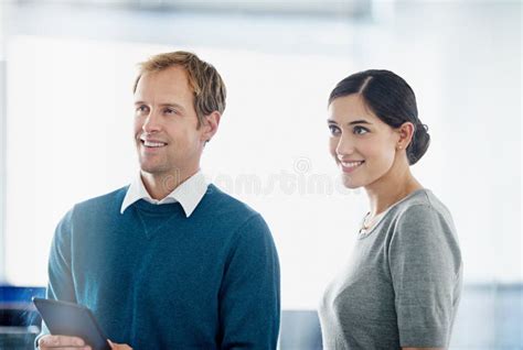 Business Woman And Man With Tablet In Office For Planning Reading Digital Report And