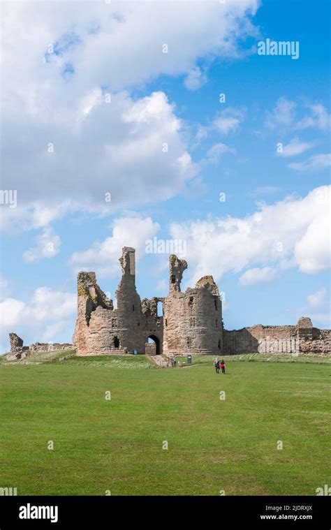 Northumberland Castle Uk View In Summer Of The Ruins Of Dunstanburgh