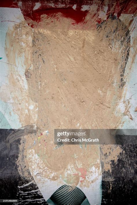 A Poster Of Bashar Al Assad With His Face Smeared With Mud Is Seen In