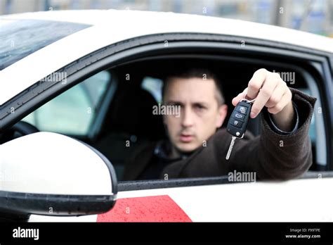 Young Man Using New Car Navigation And Onboard Vehicle Transport System