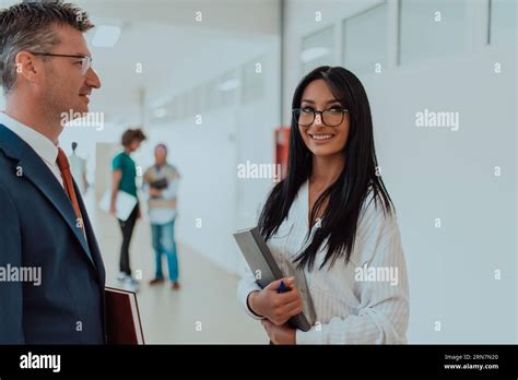business colleagues engage in a knowledge sharing conversation during a