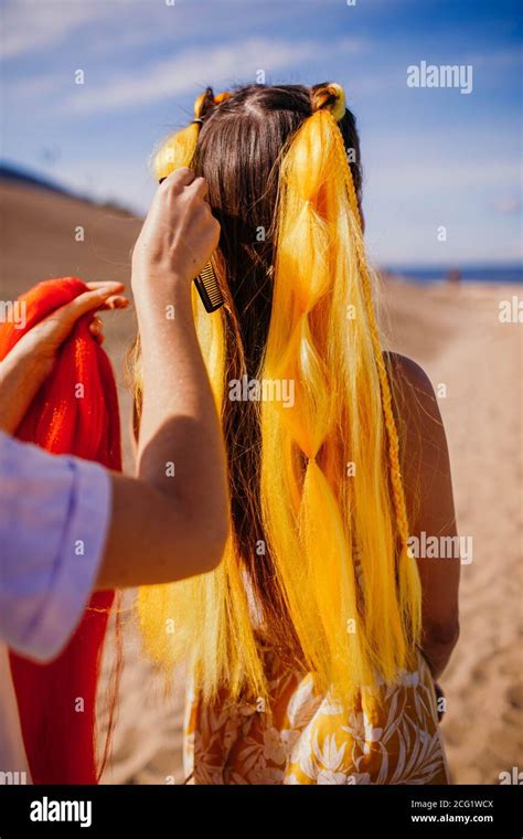 Yellow Kanekalon With Pigtails On The Womansunny Summer Day On The