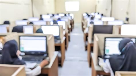 Premium Photo Blurred Image Of Amount Of Babes Working On A Computerbased Competency Test