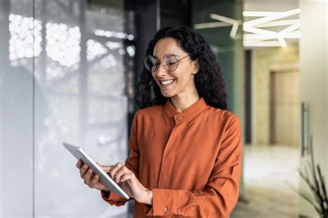 Premium Photo Indian Female Programmer Standing Inside The Office With A Tablet Computer In