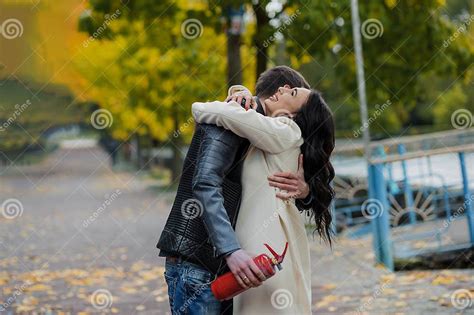 A Man Hugs A Pregnant Woman A Man Uses A Fire Extinguisher To