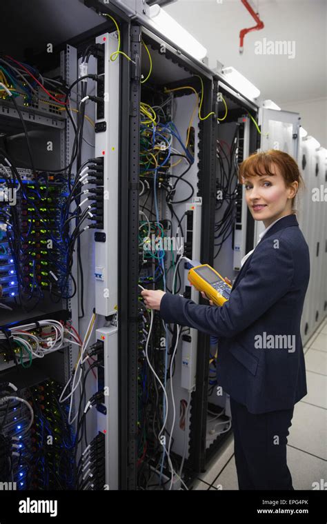 Happy Technician Using Digital Cable Analyzer On Server Stock Photo Alamy