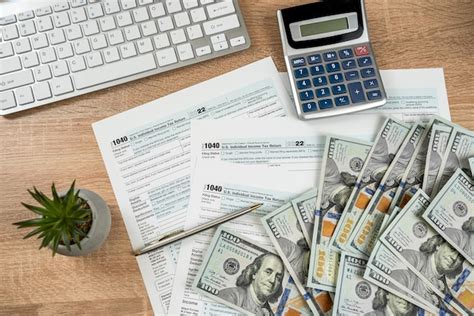 Premium Photo 1040 Individual Income Tax Form With Pen Calculator And