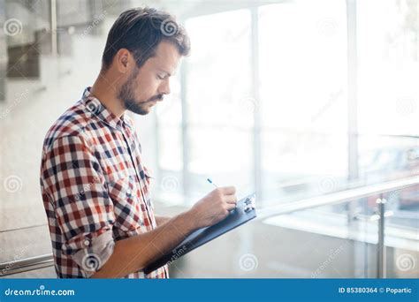 Casual Employee With Clipboard Stock Photo Image Of Meeting Seminar