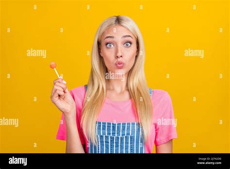 Portrait Of Attractive Funny Girly Teenage Girl Licking Candy Staring Eyes Pout Lips Isolated