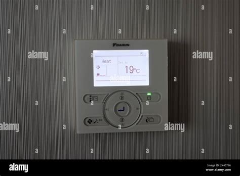Room Thermostat Set To 19 Degrees For Heating Concept Of Saving On Energy Consumption Stock