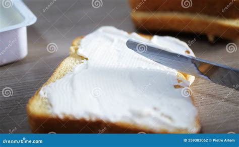 Knife Spreading Butter On A Piece Of Bread Close Up View Breakfast Or