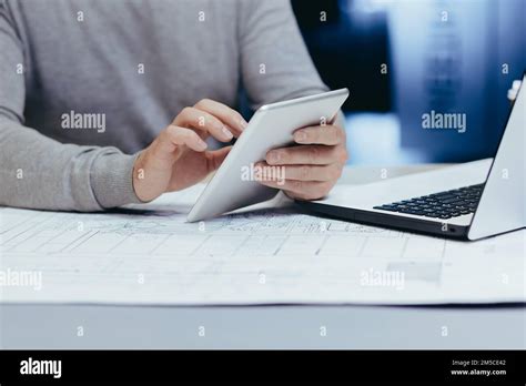 Close Up Photo Of Hands Of Male Designer Architect Working With Tablet