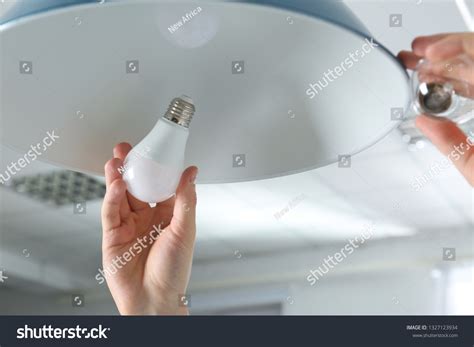 Man Changing Light Bulb Pendant Lamp Stock Photo 1327123934 Shutterstock