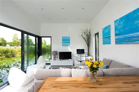 Baca Architects Moors Wooden Floating Home On Chichester Canal