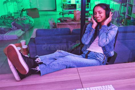 Programmer Headphones Or Relax In Neon House After Technology Coding