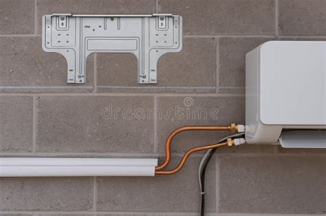 Wall Mounted Air Conditioner Installation With Copper Pipes Stock