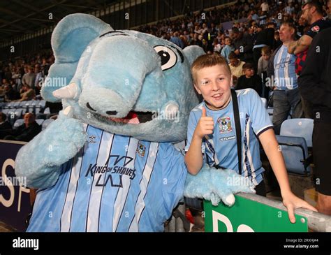 Coventry City Mascot Sky Blue Sam Poses For A Photo With Fans At Half