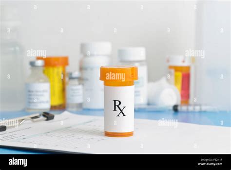 Prescription Bottle On Patient Chart With Medication Bottles And