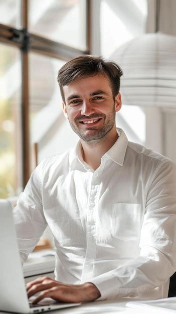 Premium Photo A Man Sitting In Front Of A Laptop Computer