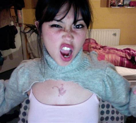 A Woman With Her Mouth Open And Tongue Out