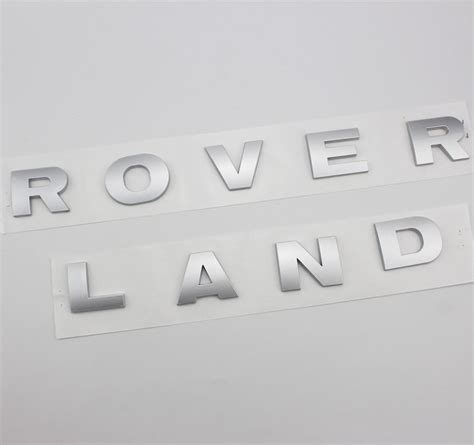 โลโก้ฝากระโปรงหน้ารถสำหรับ Land Rover สติกเกอร์สัญลักษณ์ตัวอักษรสัญลักษณ์ด้านหลังรถสีเงินด้าน