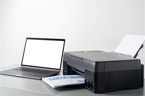 Premium Photo Printer And Laptop On Grey Table In Office
