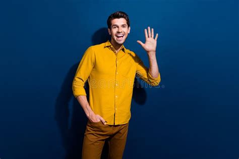 Photo Portrait Of Handsome Young Guy Wave Hand Hello Excited Wear